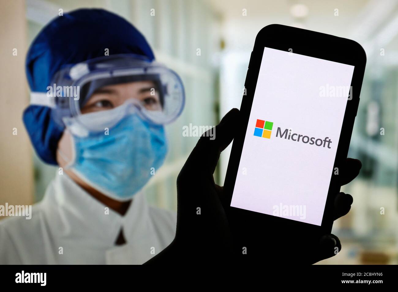 In this photo illustration a Microsoft logo seen displayed on a ...