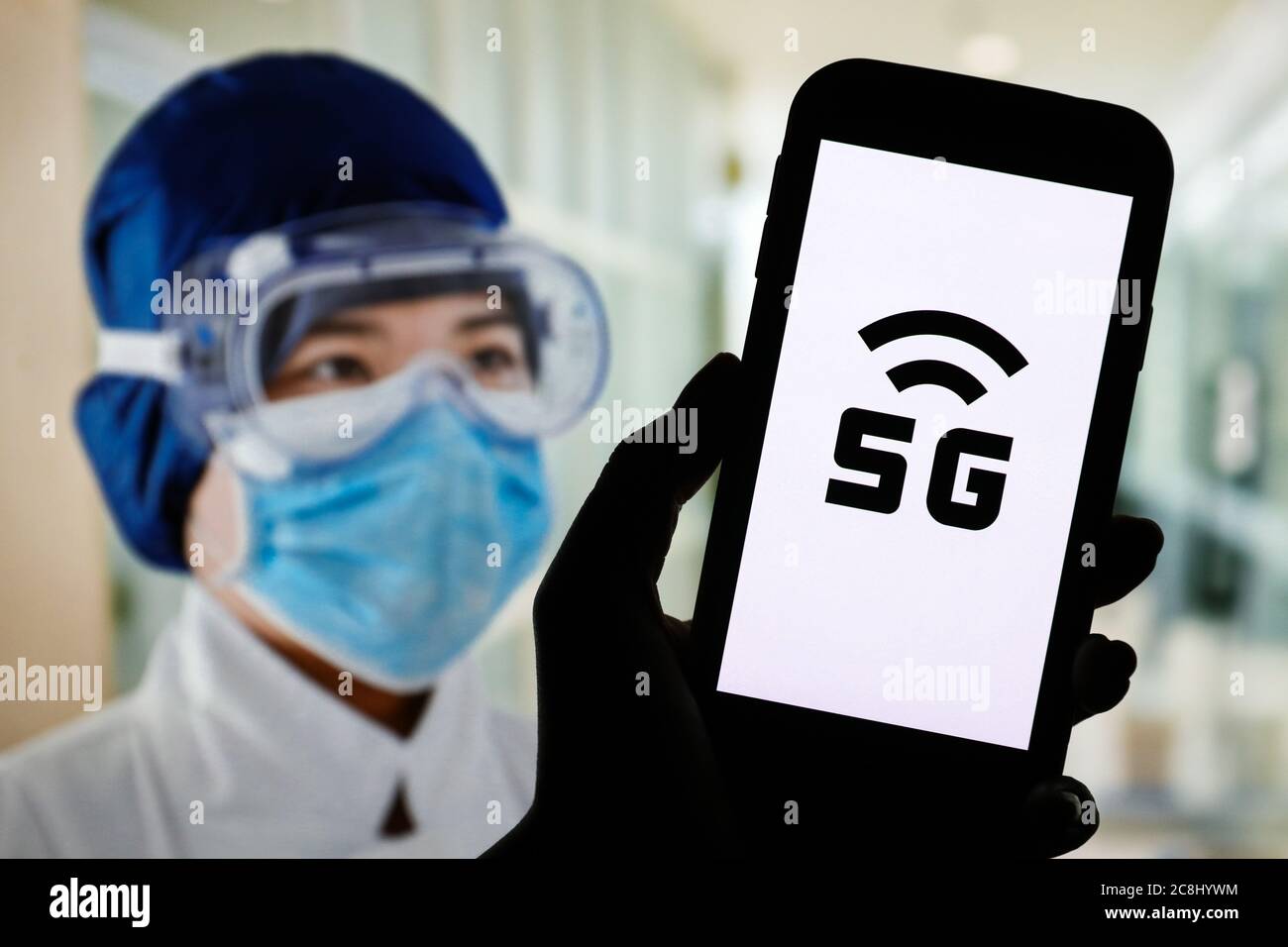 In this photo illustration a 5G logo seen displayed on a smartphone ...