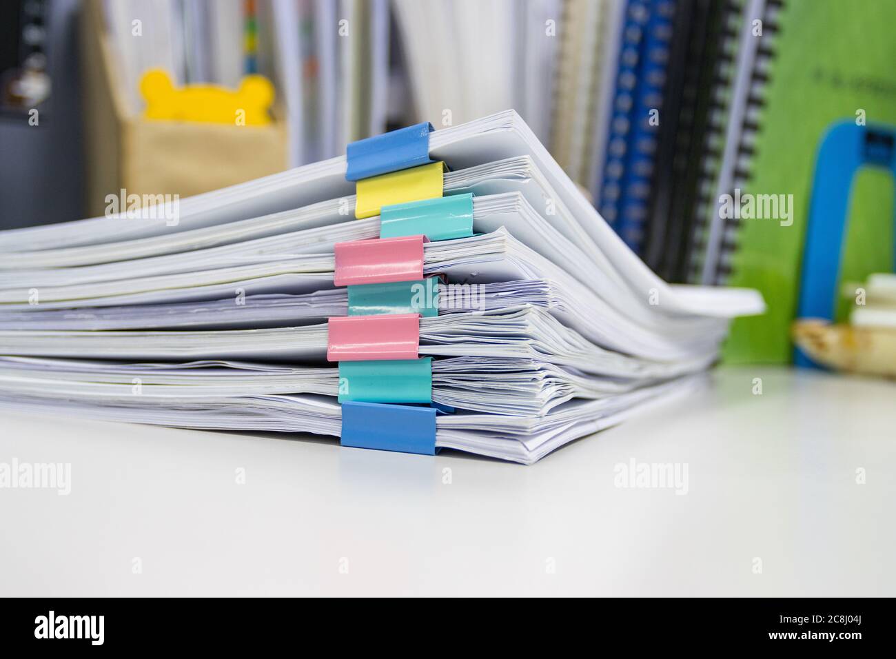 file folder and Stack of business report paper file on the table in a ...