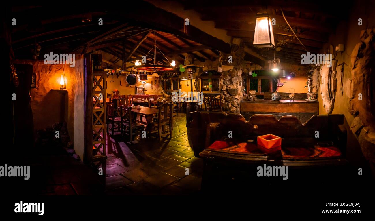Interior of a beautiful and cozy irish pub, full of drinks, beers and ...