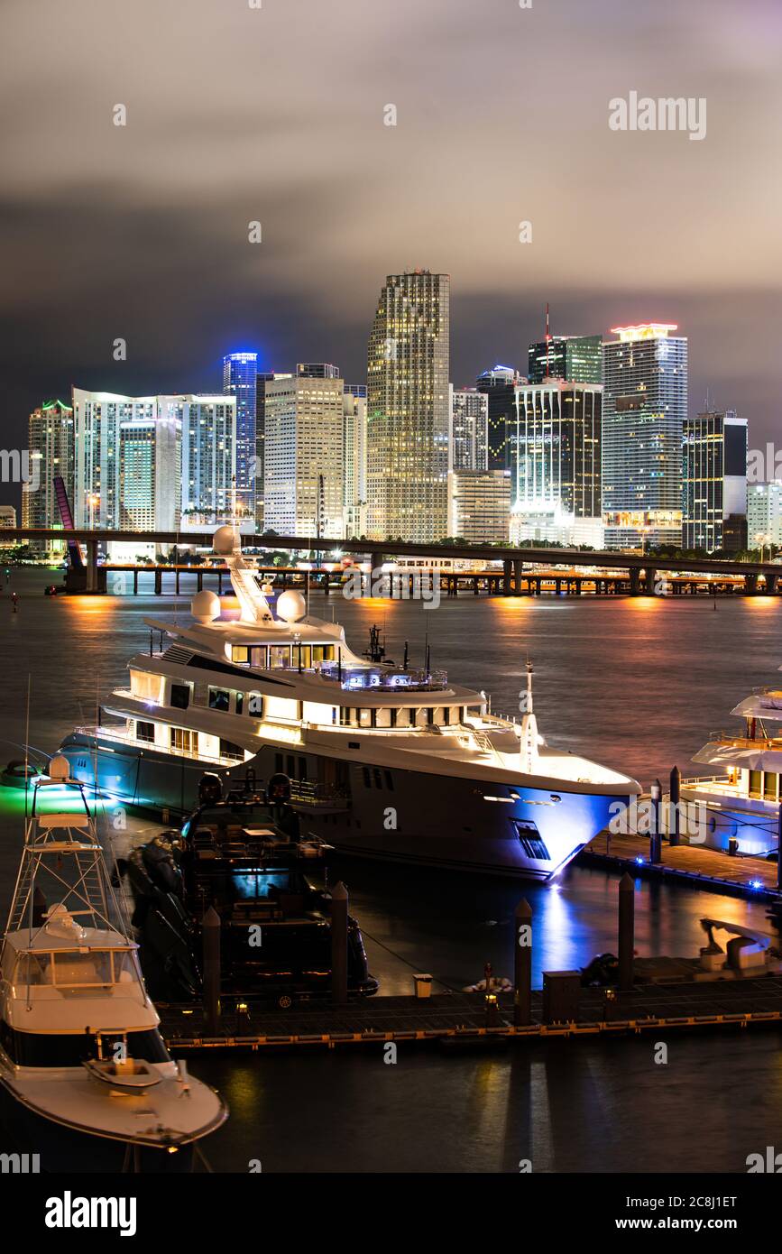 Miami Florida at sunset, skyline of illuminated buildings and Macarthur ...