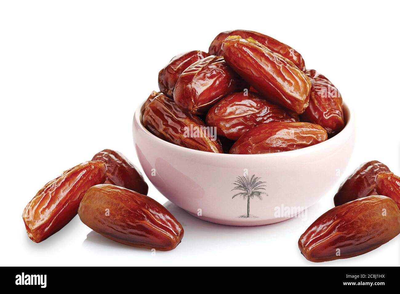 Bowl of pitted Sweet dried dates fruit isolated on white background ...
