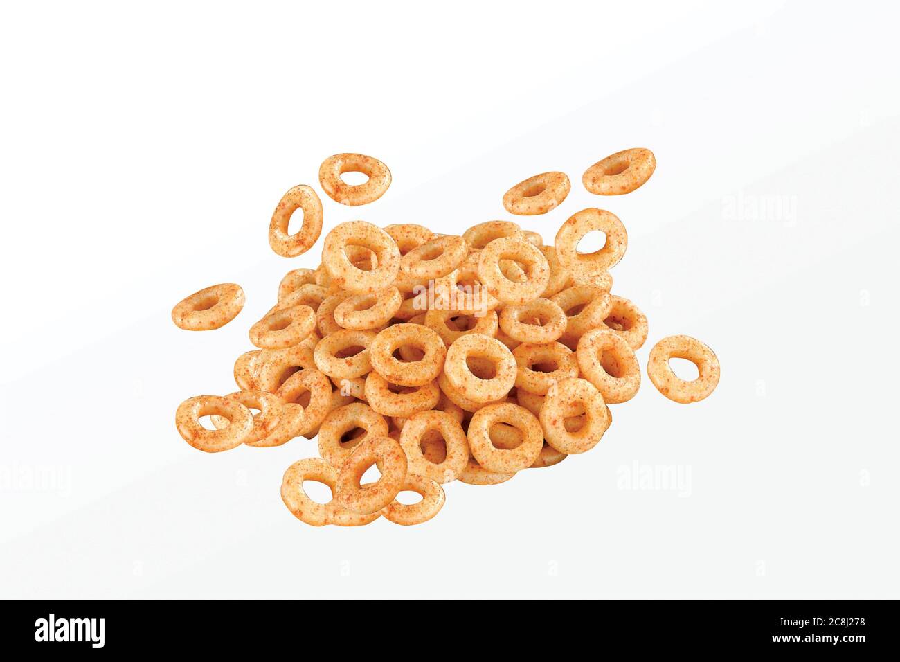 Corn round ring snacks in a vertical high glass over white Stock Photo ...