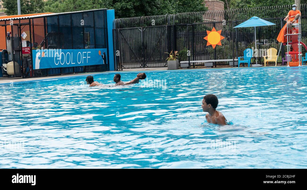 New York, USA. 24th July 2020. People seen enjoying swimming and play ...