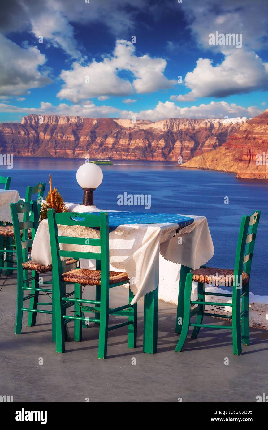 Traditional Greek restaurant with a view of the Santorini caldera at ...