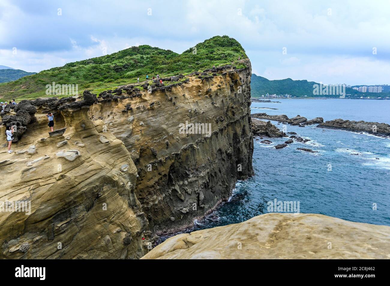 New Taipei, Taiwan - SEP 14, 2019: Many people come to visit trunk rock ...