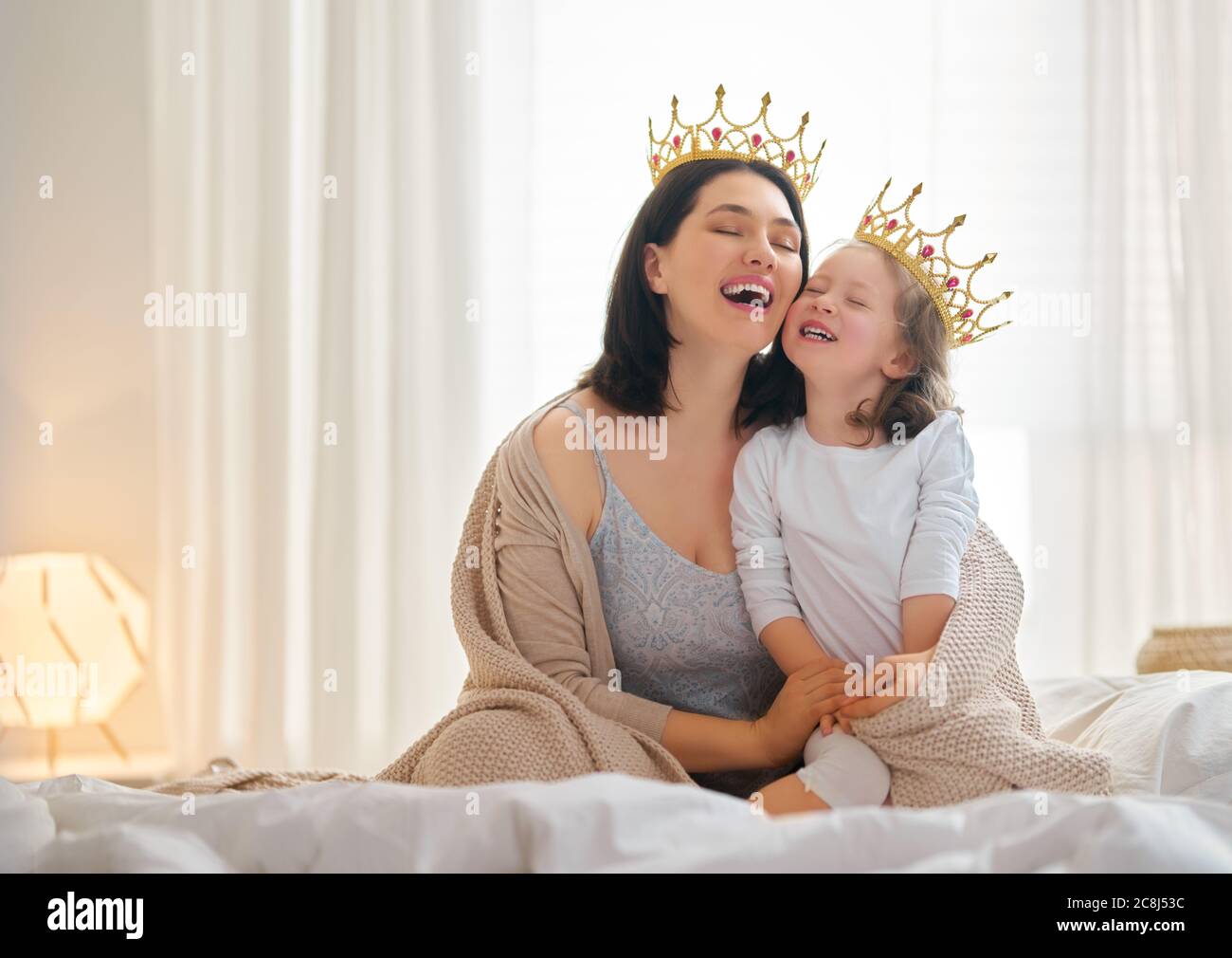 Happy loving family. Mother and her daughter child girl playing and ...