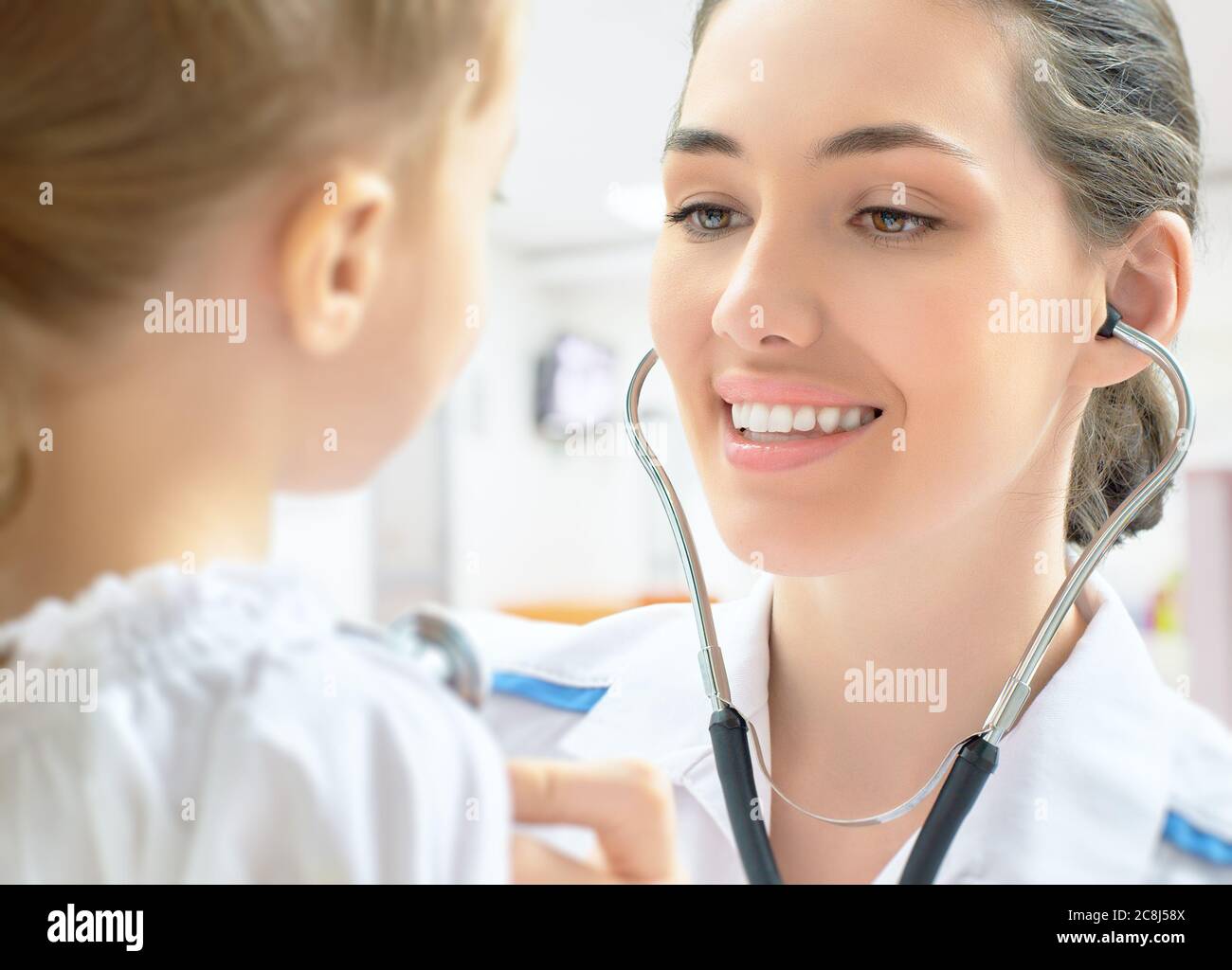 doctor examining a child in a hospital Stock Photo - Alamy