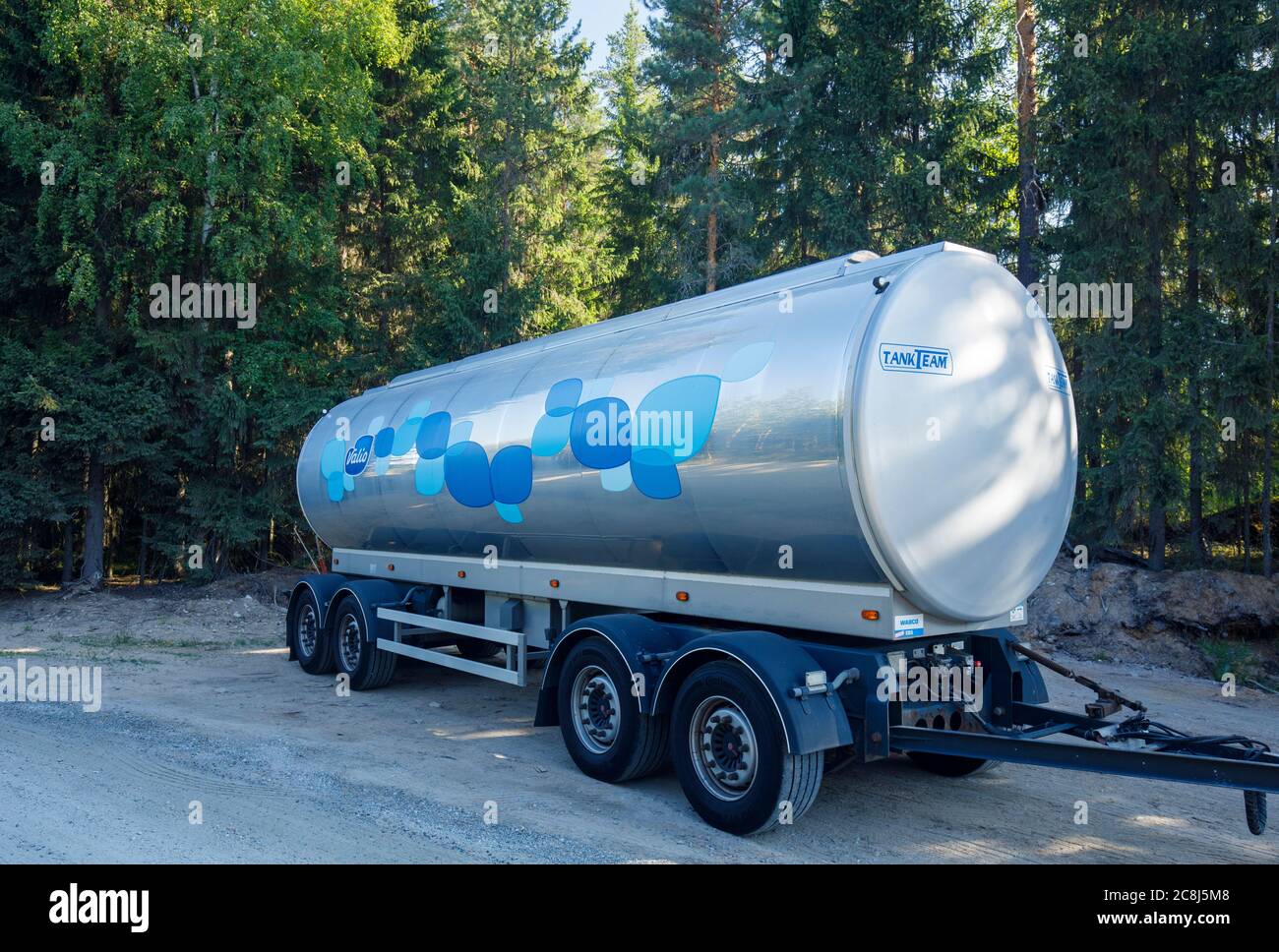 Detached parked stainless steel truck milk tank trailer at Summer ...