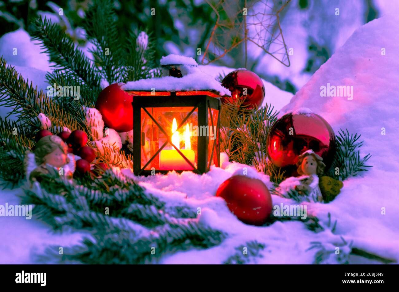 Still life: lantern with candlelight in wintry nature Stock Photo - Alamy