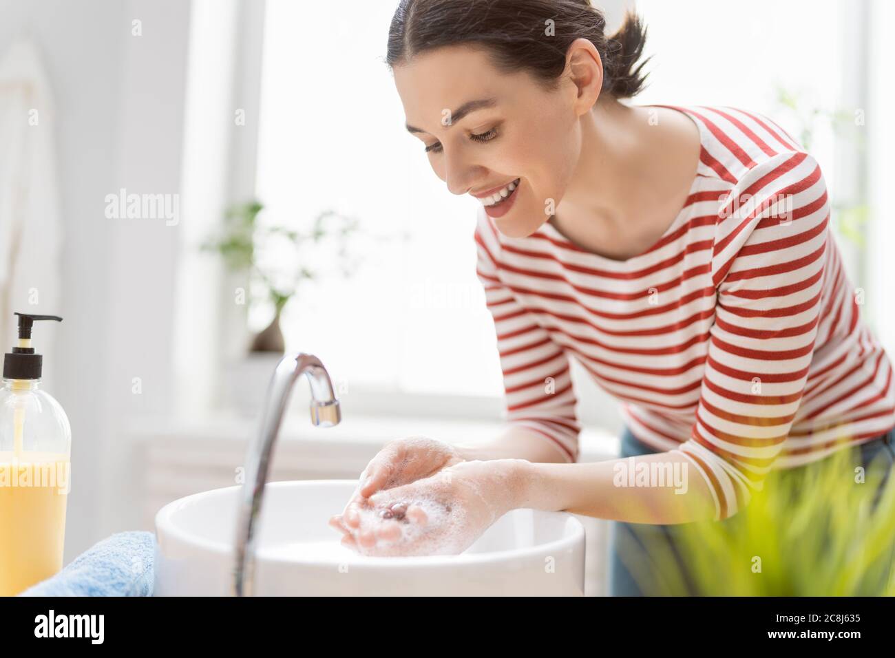 Woman washing hands hi-res stock photography and images - Alamy