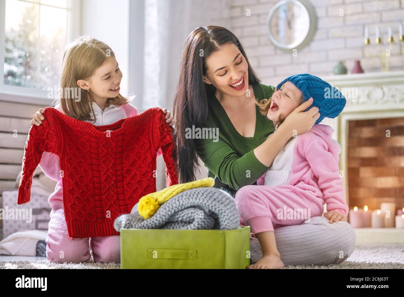Winter portrait of happy loving family wearing knitted sweaters. Mother ...