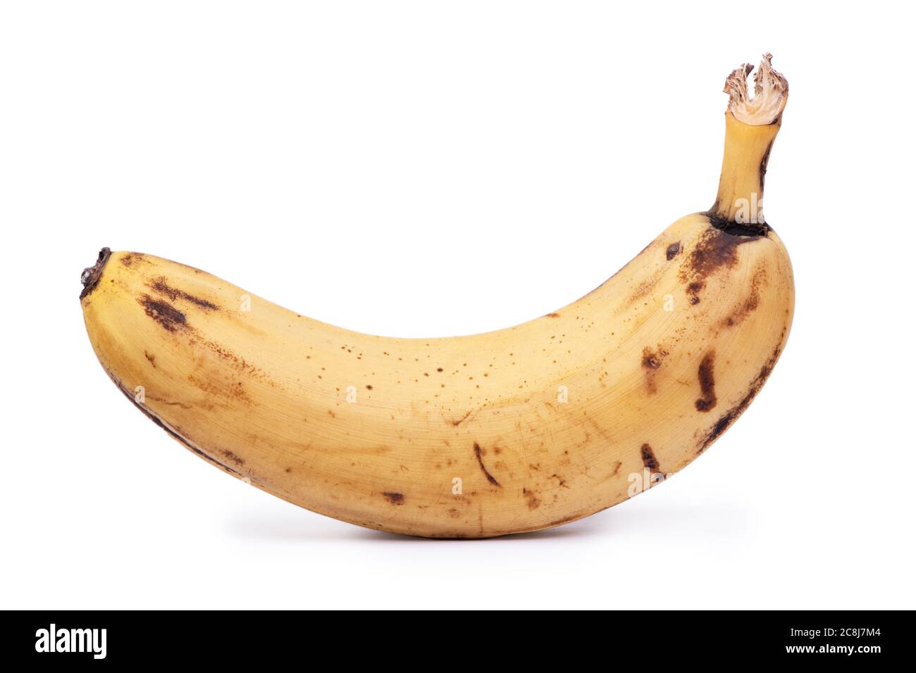 Ripe yellow banana fruit, one overripe banana with dark spots isolated ...