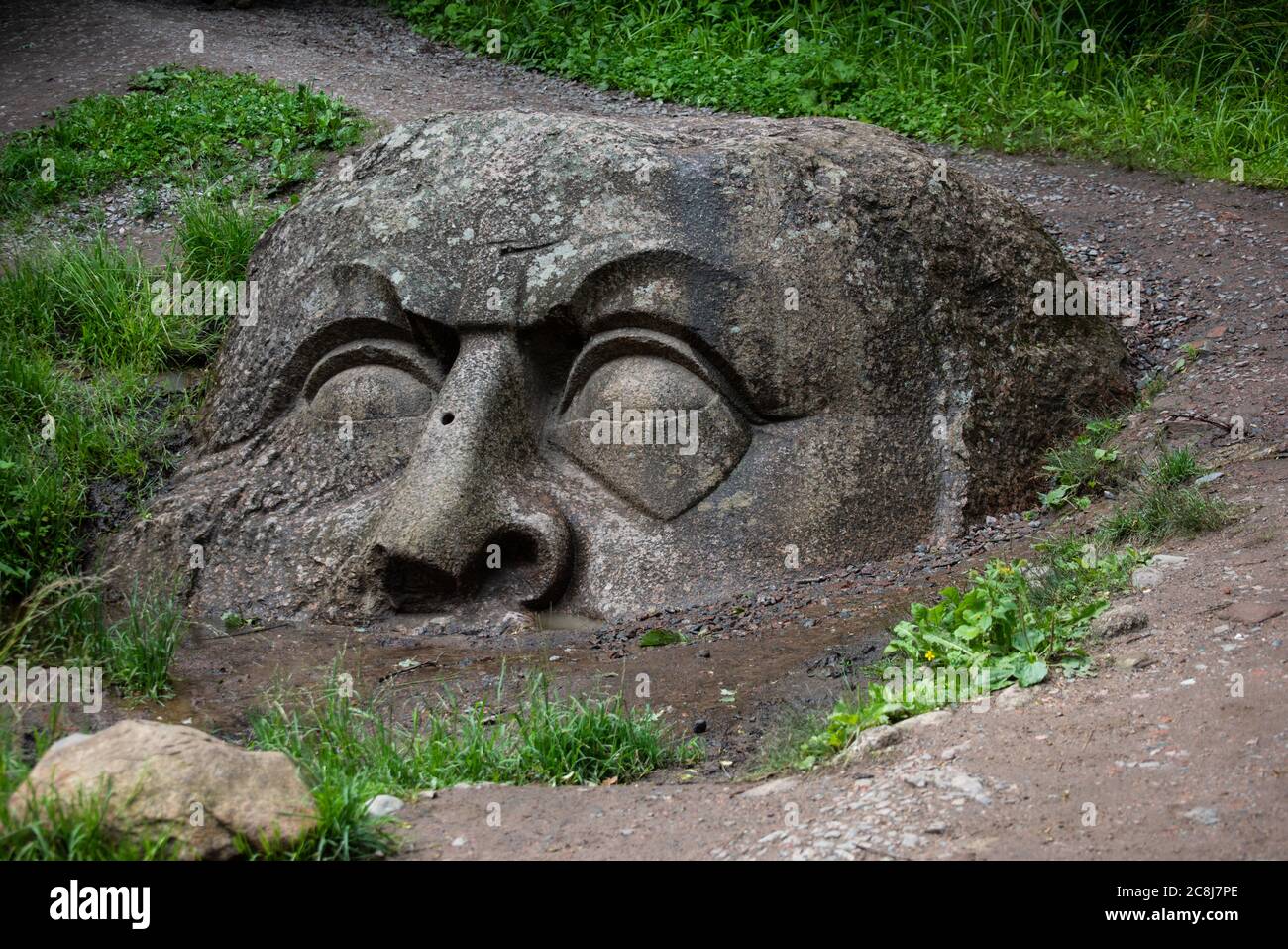 Head of ancient statue from the earth Stock Photo - Alamy