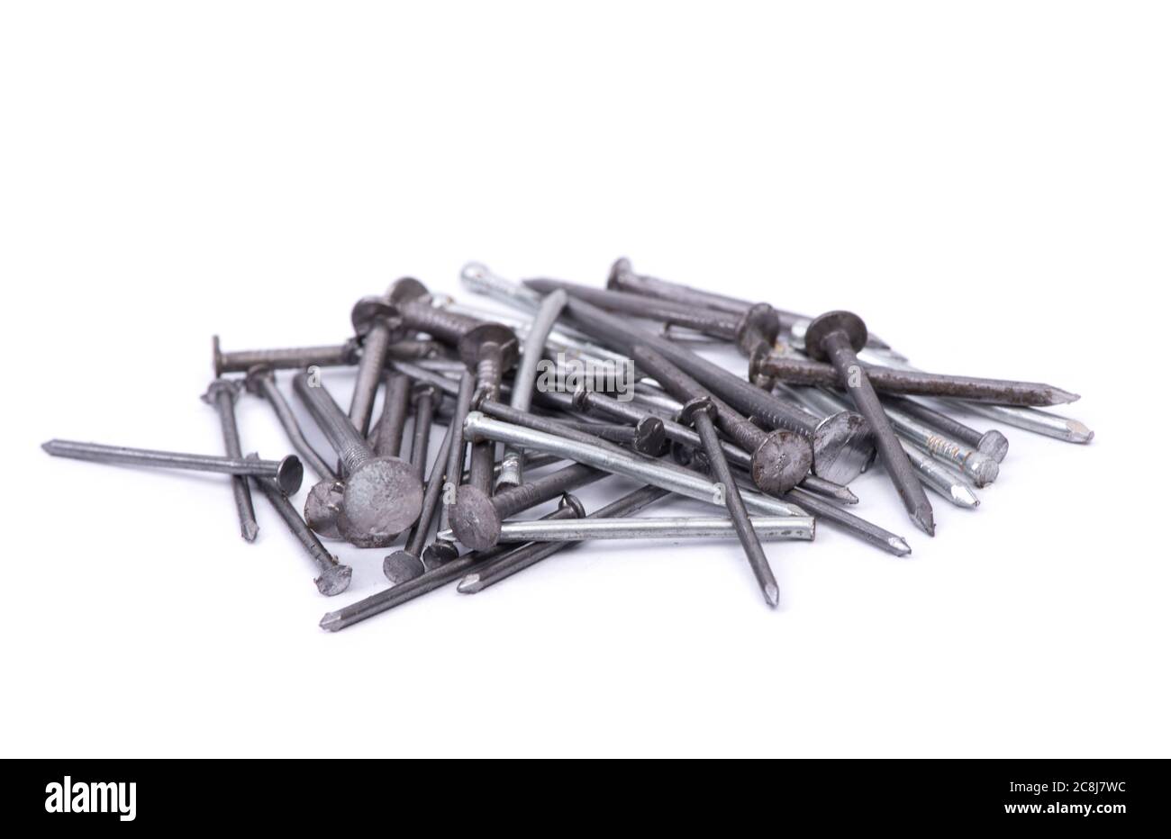 Group of small nails isolated on white background Stock Photo - Alamy