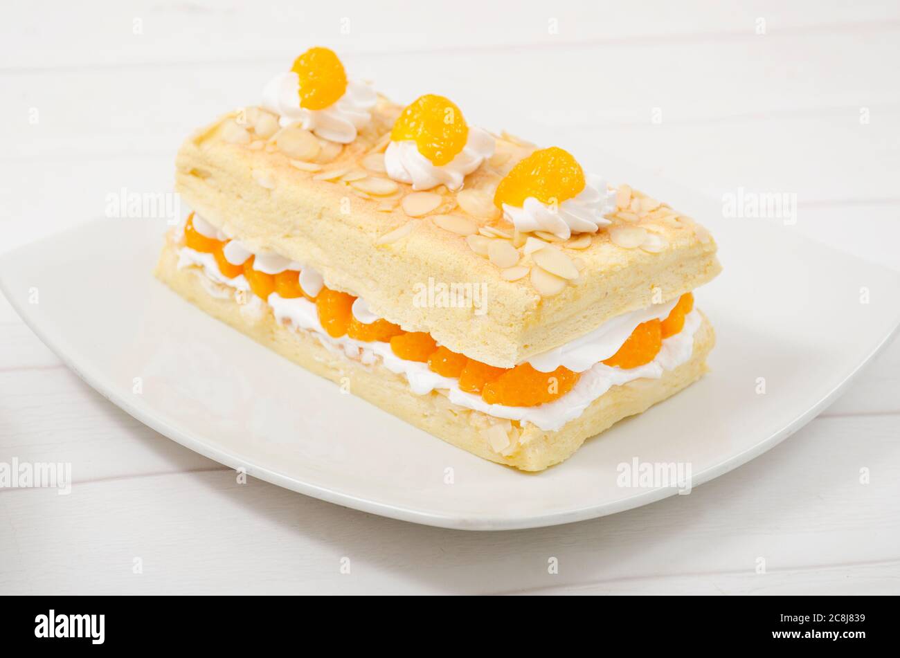 Budapest cake with cream and Mandarin Orange fruit Stock Photo - Alamy