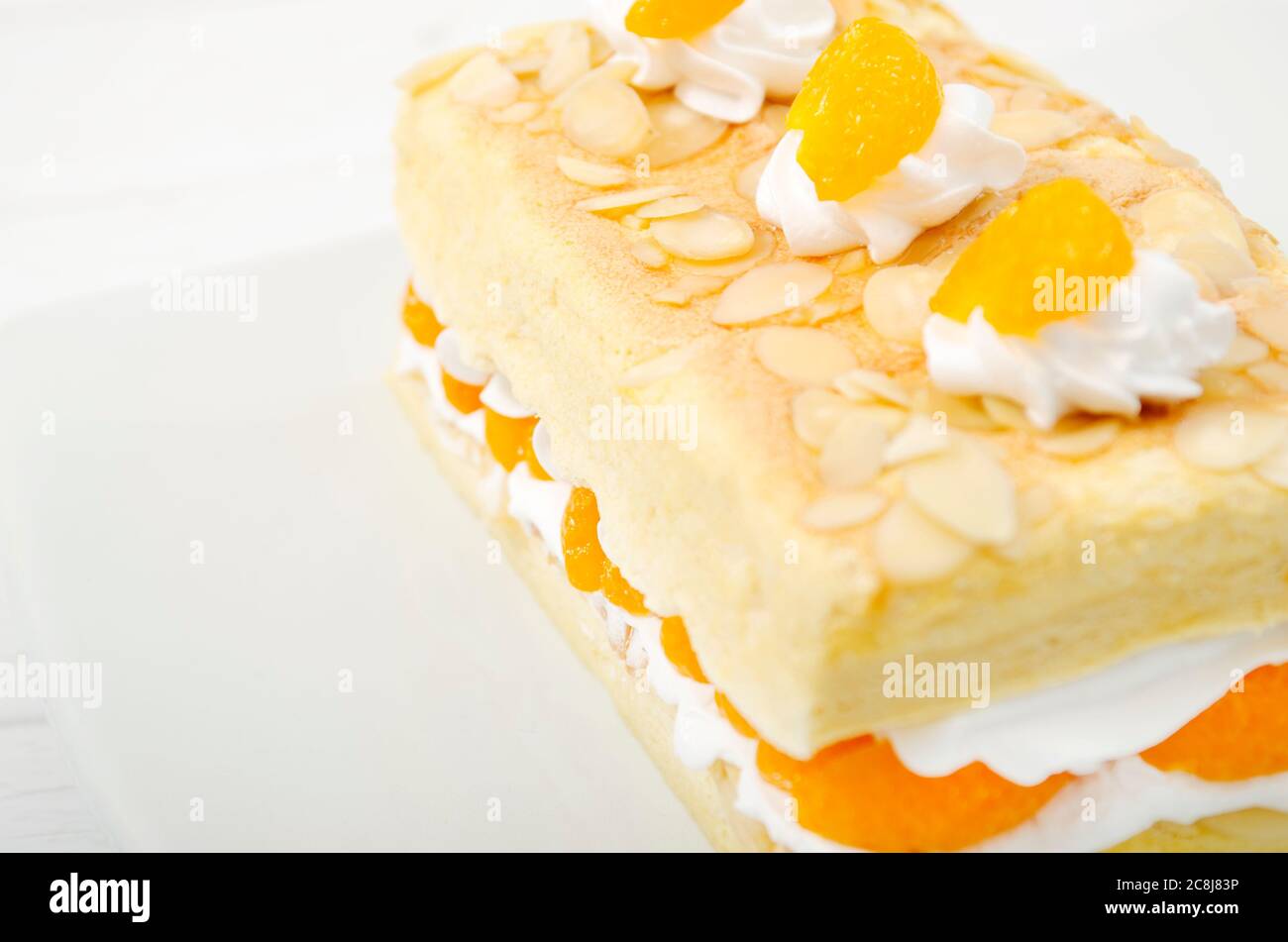 Budapest cake with cream and Mandarin Orange fruit Stock Photo - Alamy