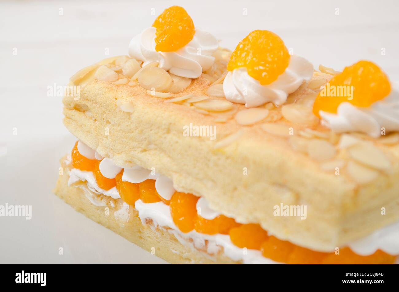 Budapest cake with cream and Mandarin Orange fruit Stock Photo - Alamy