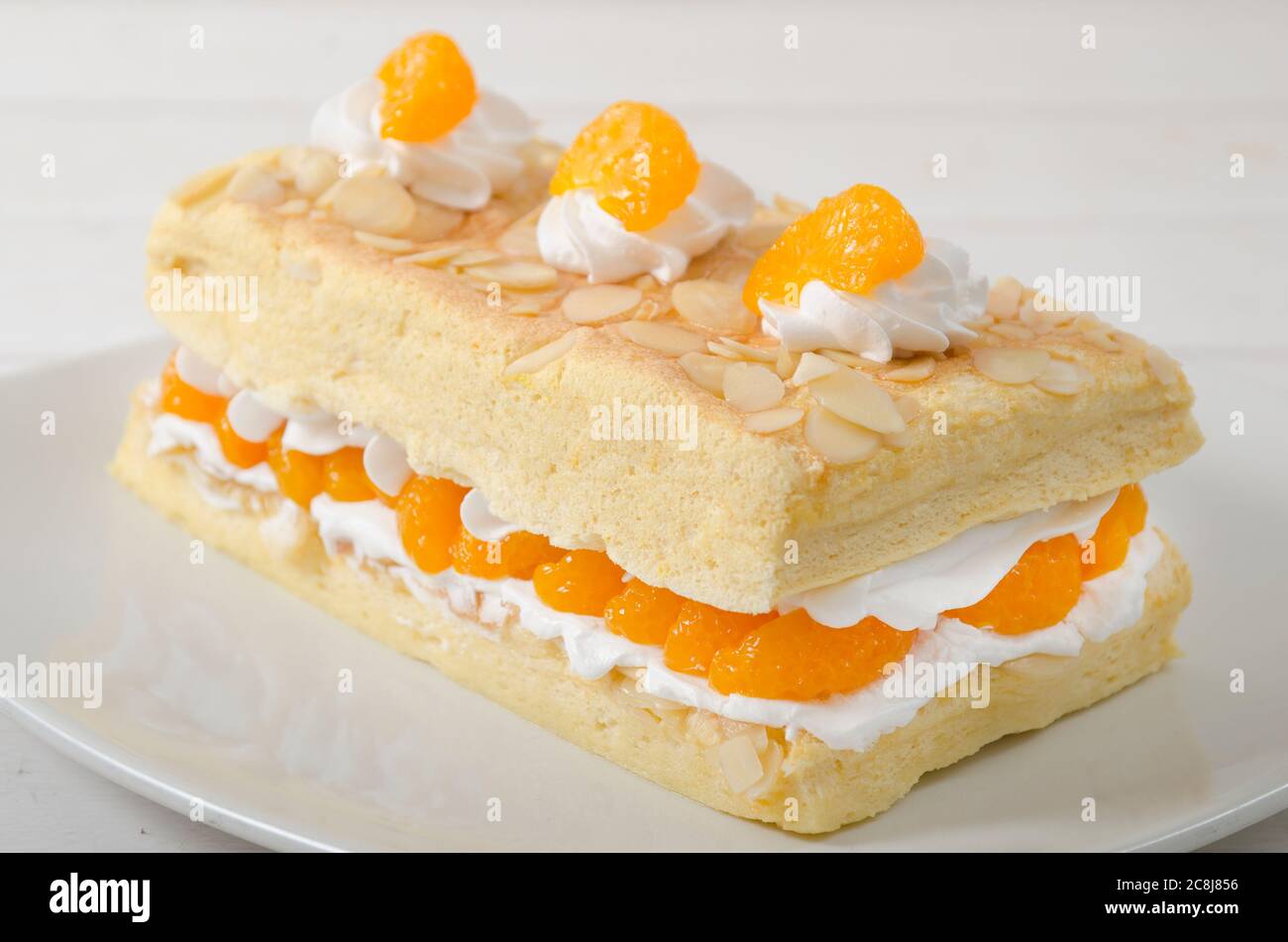 Budapest cake with cream and Mandarin Orange fruit Stock Photo - Alamy