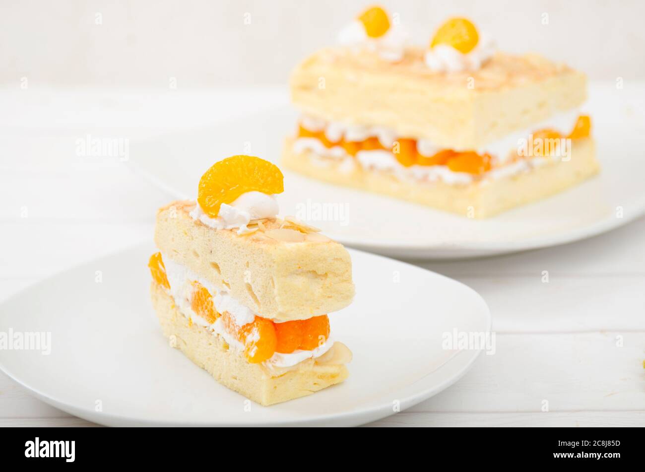 Budapest cake with cream and Mandarin Orange fruit Stock Photo - Alamy