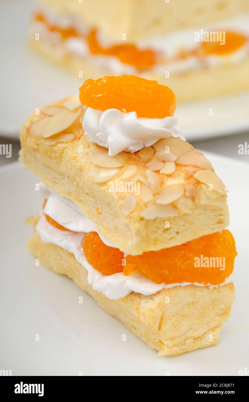 Budapest cake with cream and Mandarin Orange fruit Stock Photo - Alamy
