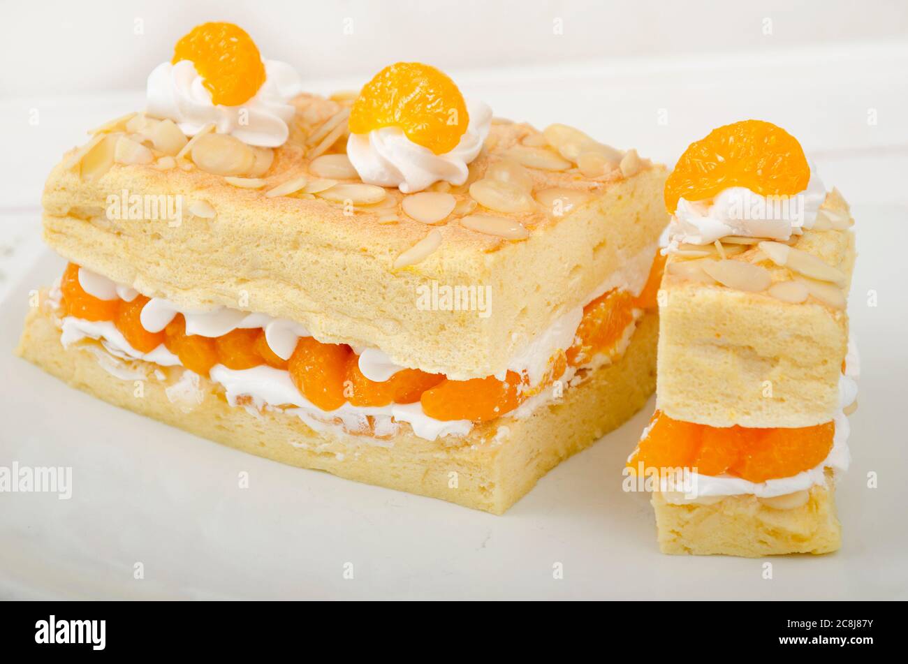 Budapest cake with cream and Mandarin Orange fruit Stock Photo - Alamy