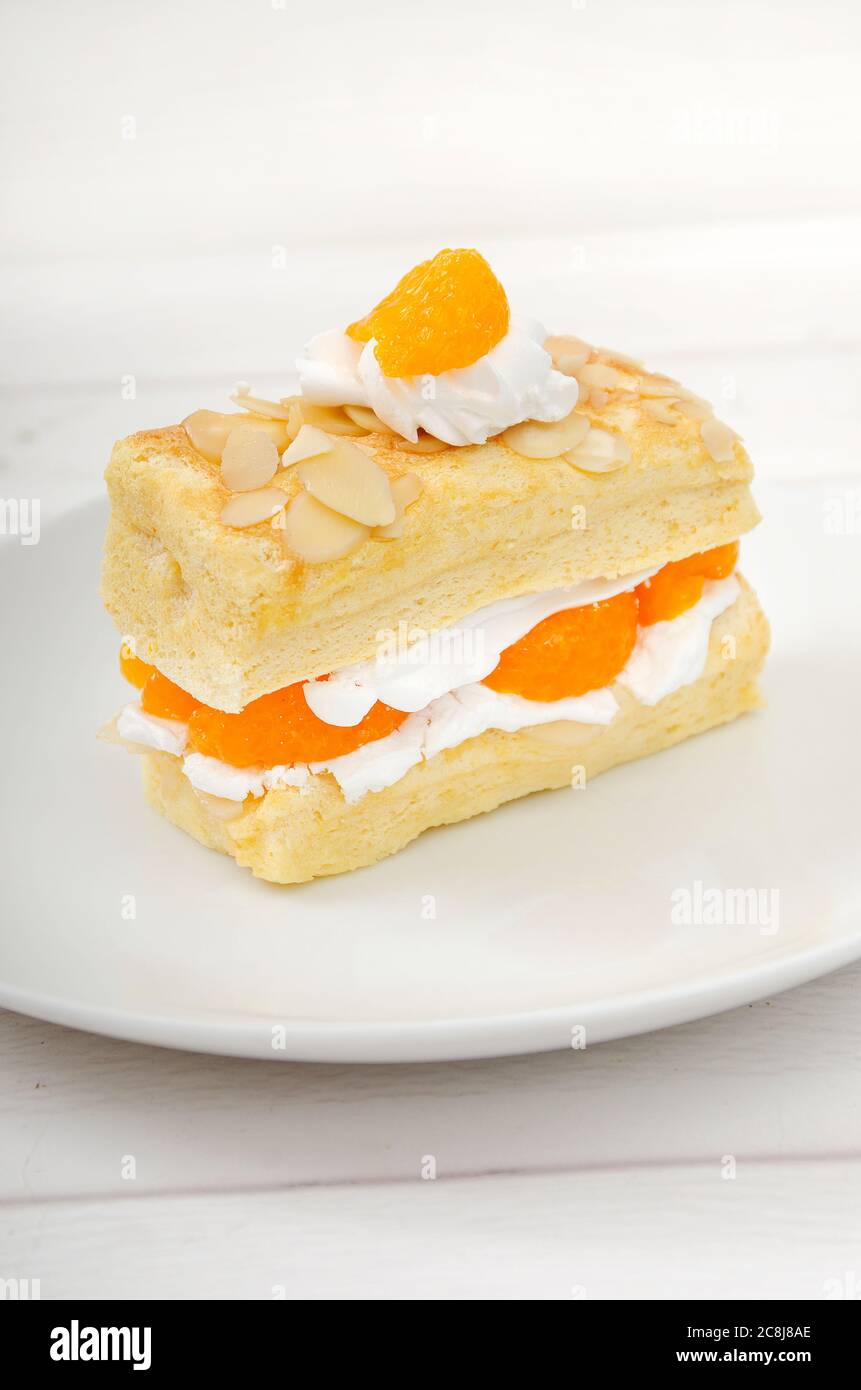 Budapest cake with cream and Mandarin Orange fruit Stock Photo - Alamy