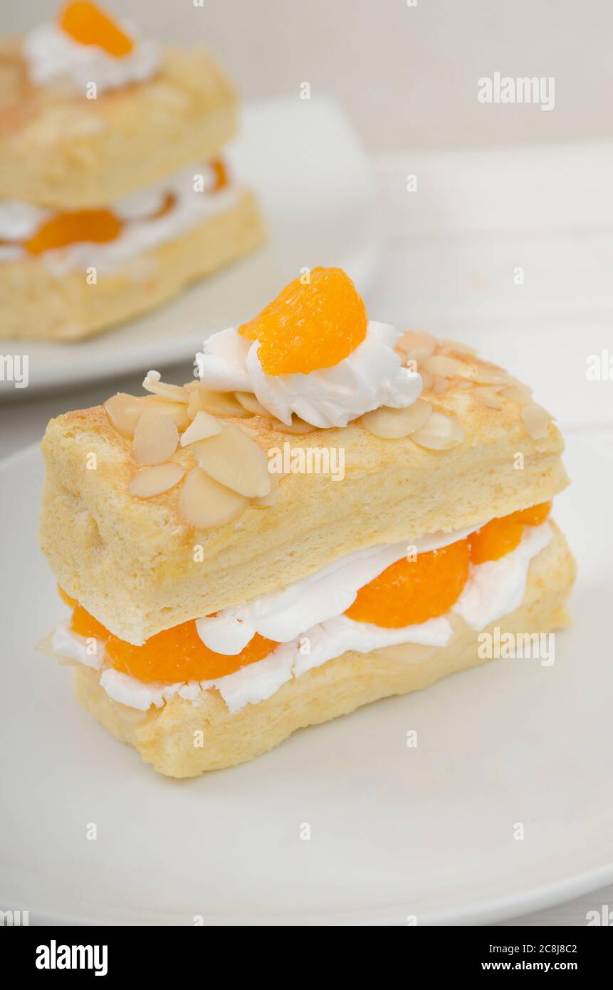 Budapest cake with cream and Mandarin Orange fruit Stock Photo - Alamy