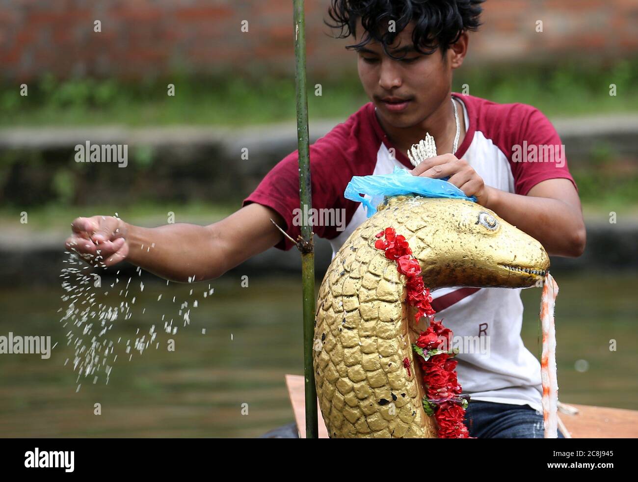 Bhaktapur, Nepal. 25th July, 2020. A devotee offers prayers to the ...