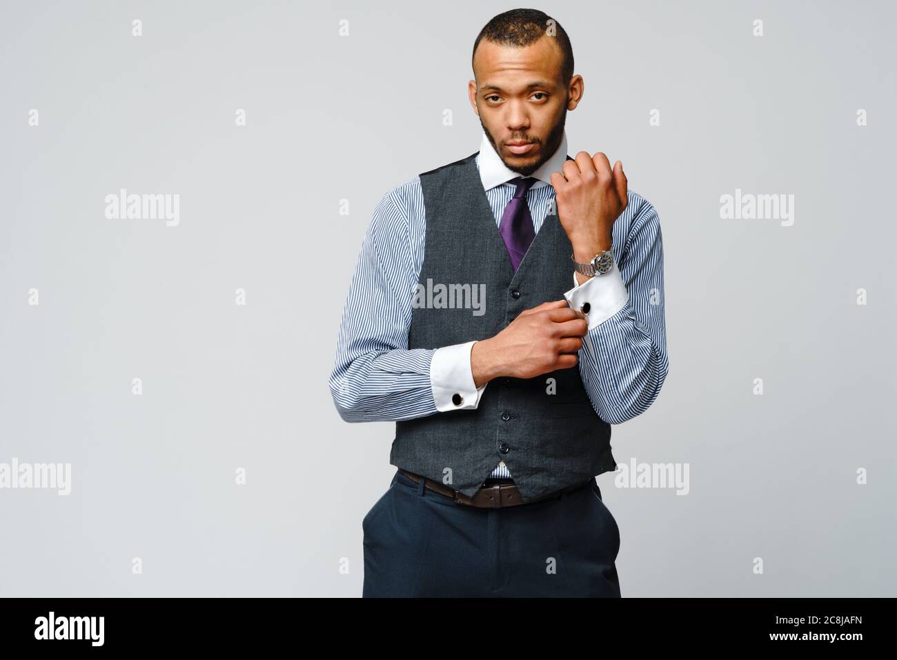 African-American man face portrait over grey background Stock Photo - Alamy