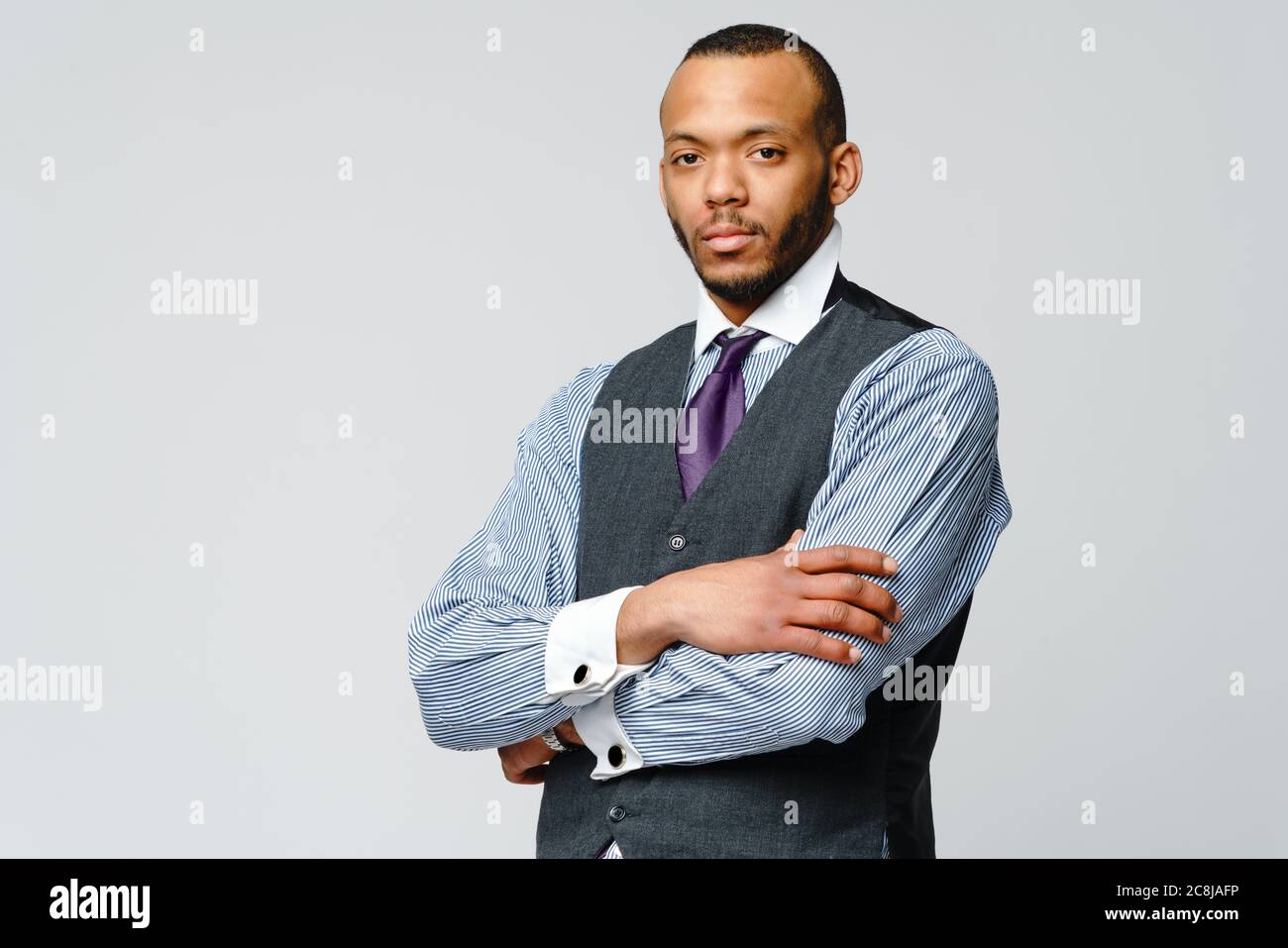 African-American man face portrait over grey background Stock Photo - Alamy