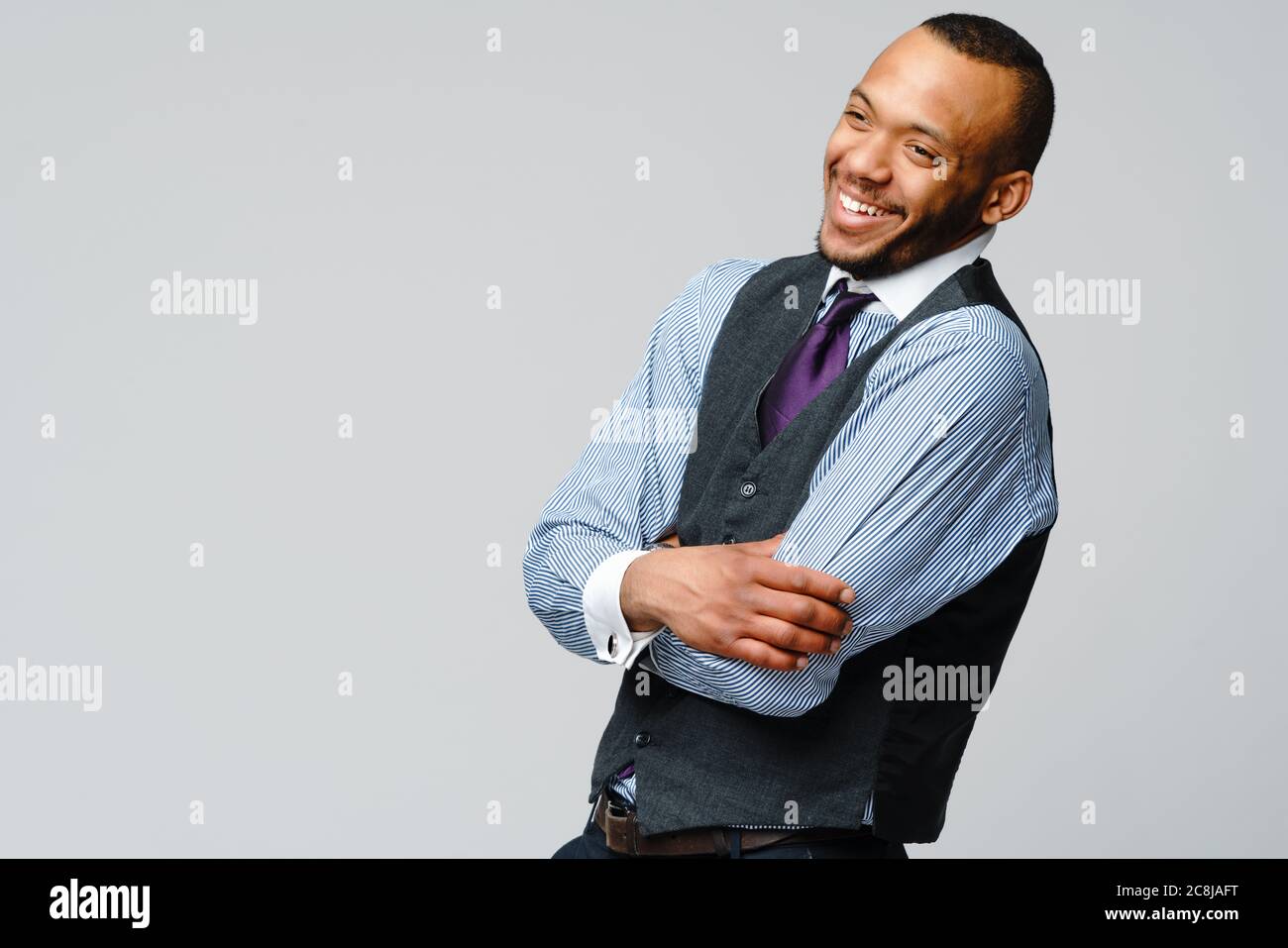 African-American man face portrait over grey background Stock Photo - Alamy