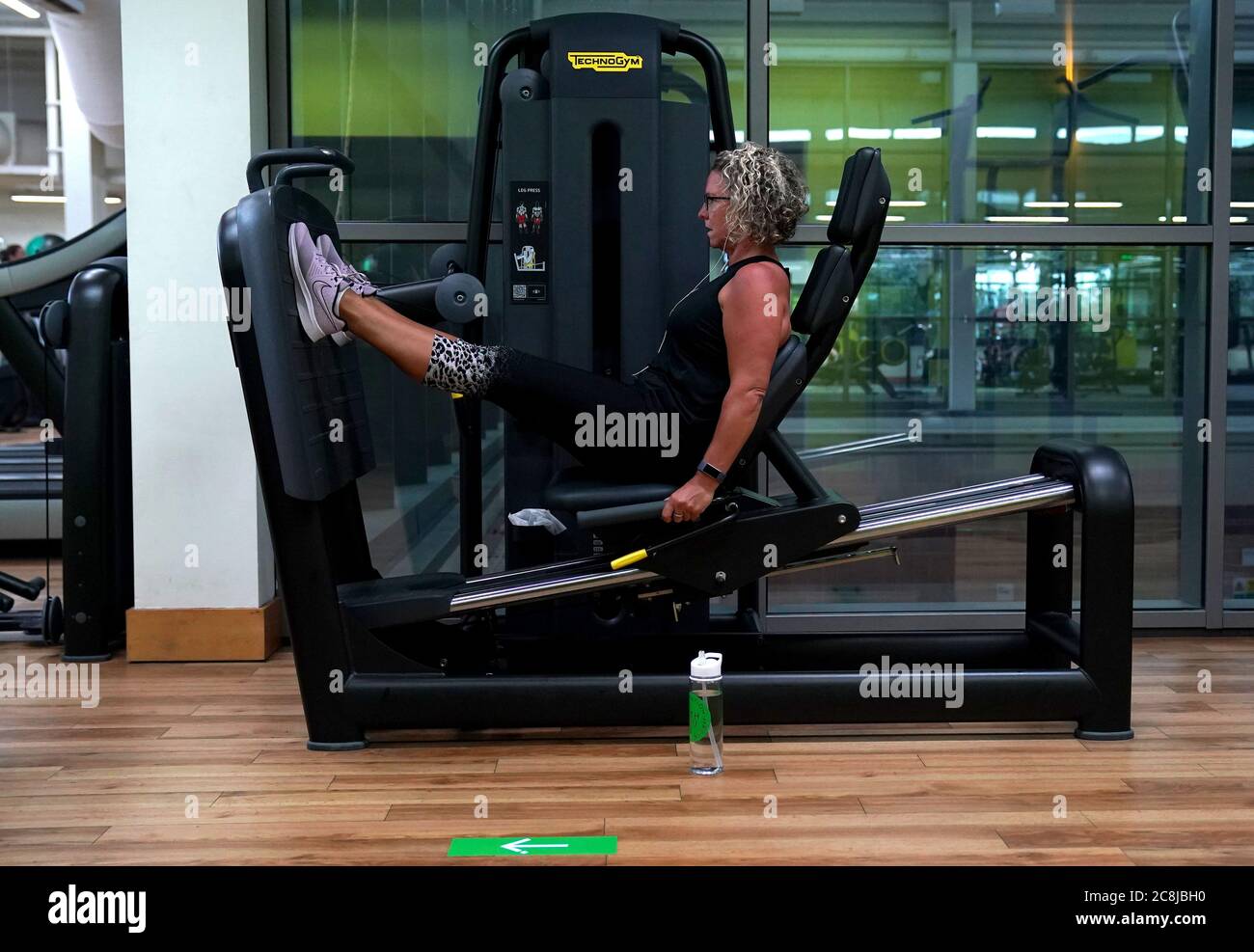 Gym members exercise at Nuffield Health Sunbury gym as indoor gyms ...