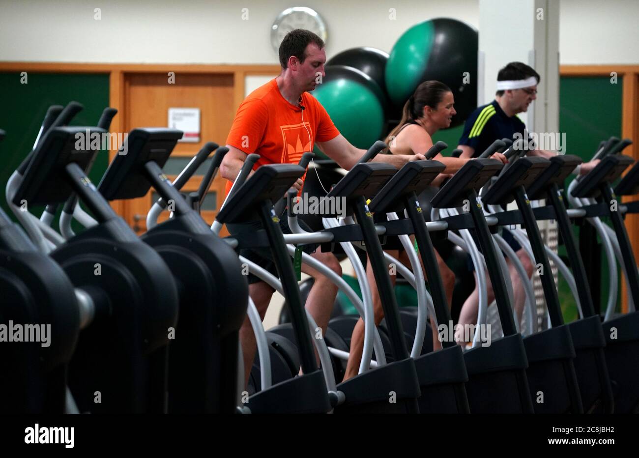 Gym members exercise at Nuffield Health Sunbury gym as indoor gyms ...
