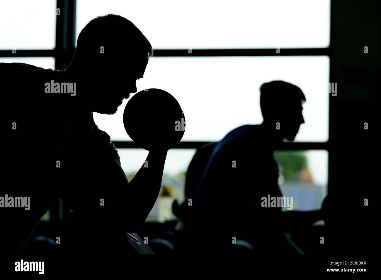Gym members exercise at Nuffield Health Sunbury gym as indoor gyms ...
