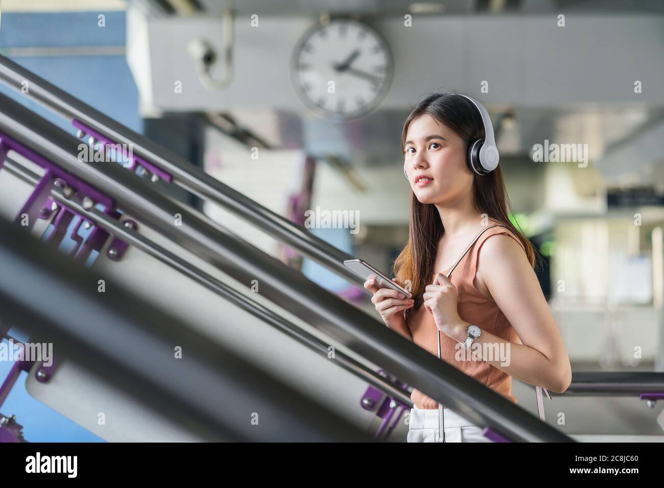 Woman with headphone in train hi-res stock photography and images - Alamy