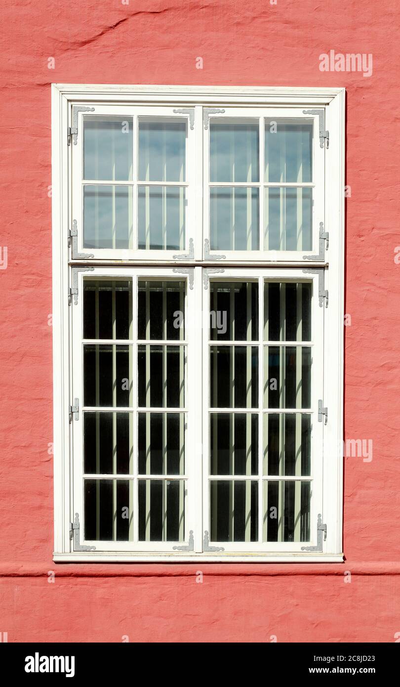 old, decorated white window on a red house wall Stock Photo - Alamy