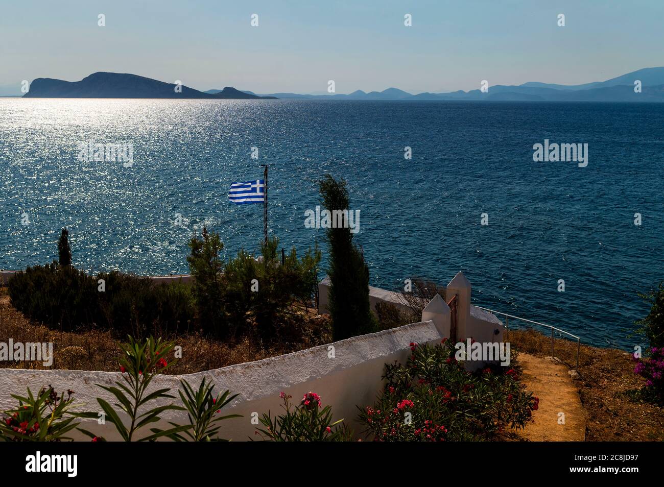 Hydra, Greece. 24th July, 2020. A Greek flag is waving in the wind. The ...