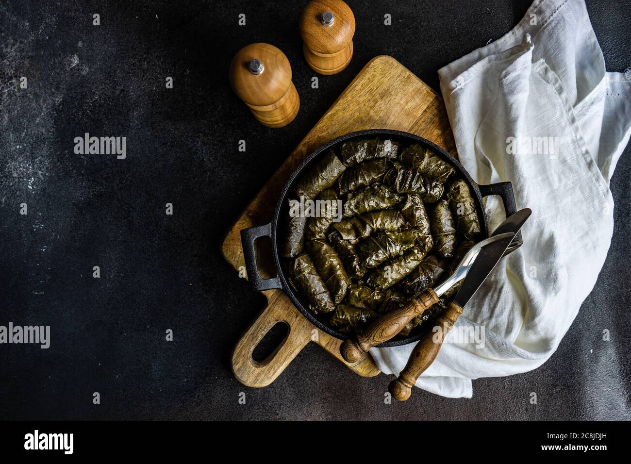Traditional georgian tolma in vine leaves on rustic background with ...
