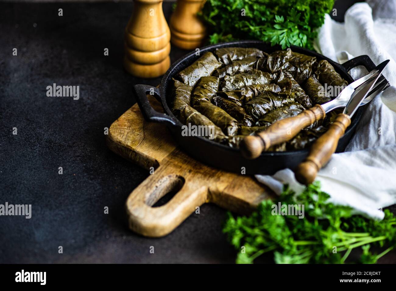 Traditional georgian tolma in vine leaves on rustic background with ...