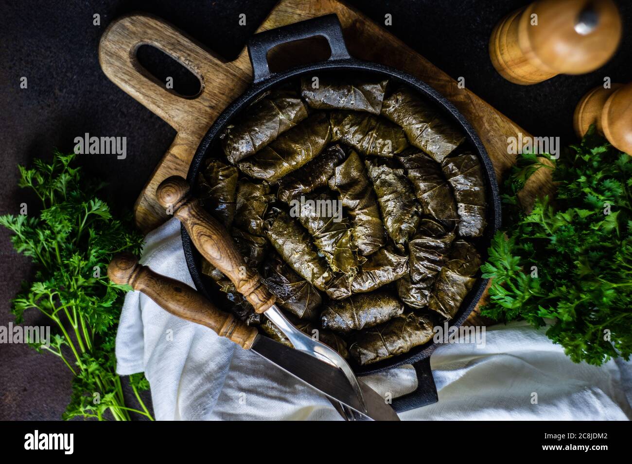 Traditional georgian tolma in vine leaves on rustic background with ...