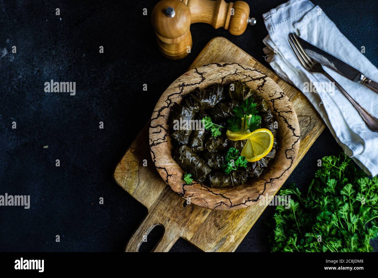 Traditional georgian tolma in vine leaves on rustic background with ...