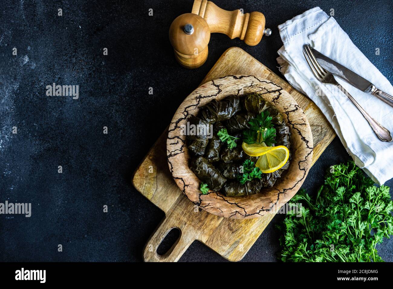 Traditional georgian tolma in vine leaves on rustic background with ...