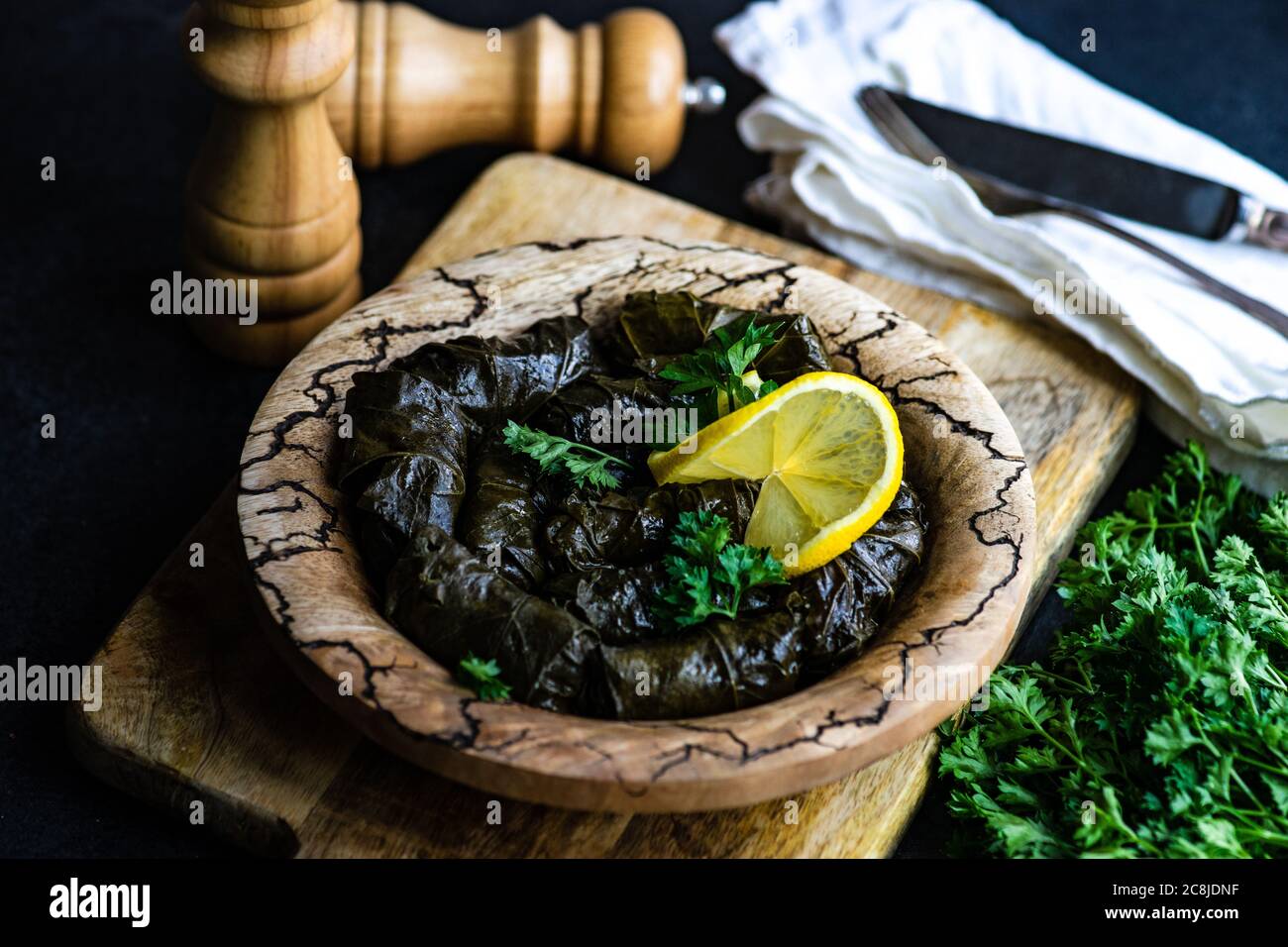 Traditional georgian tolma in vine leaves on rustic background with ...