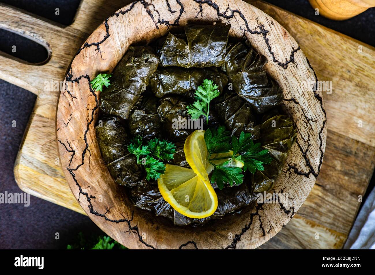 Traditional georgian tolma in vine leaves on rustic background with ...