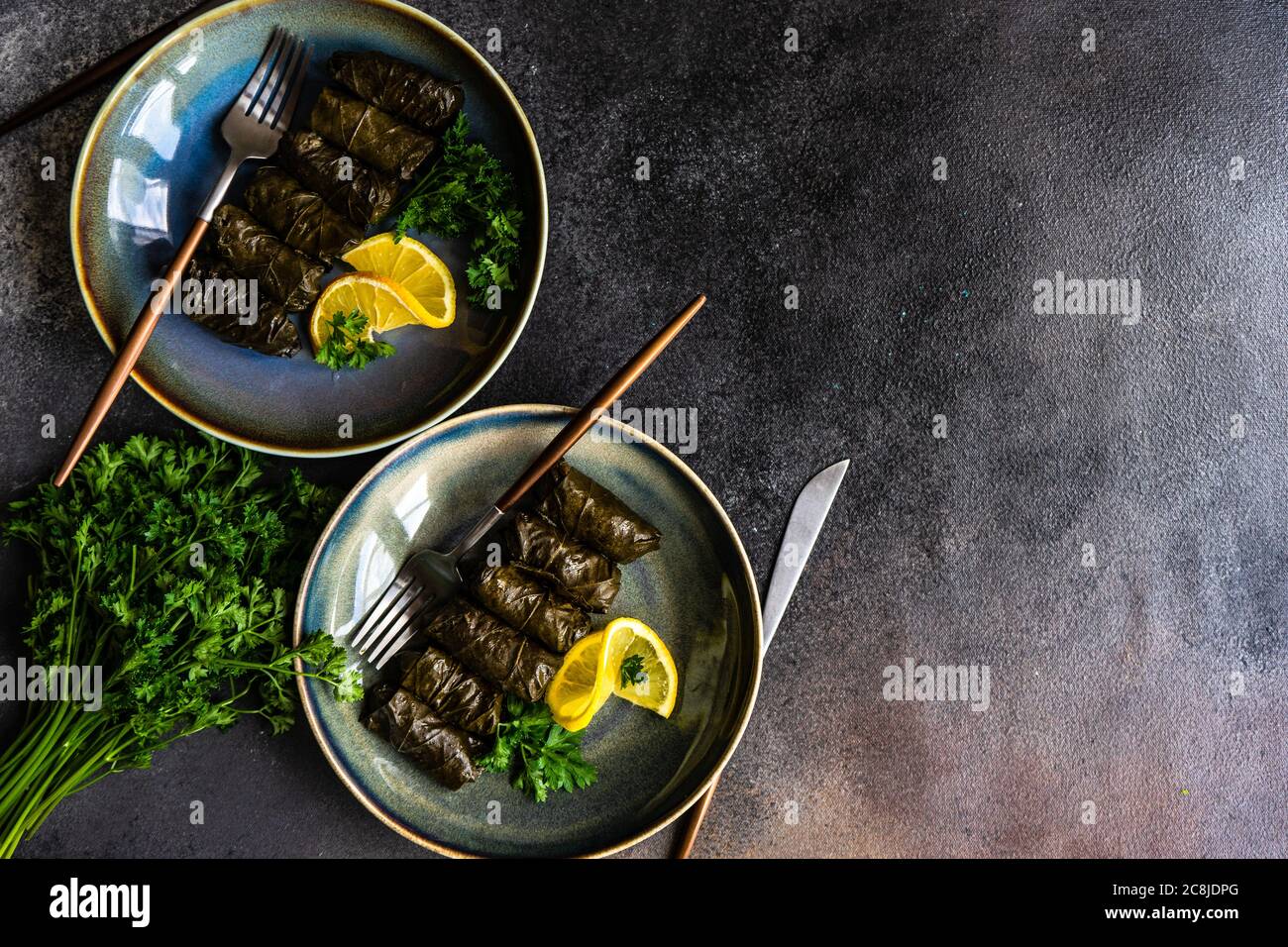 Traditional georgian tolma in vine leaves on rustic background with ...