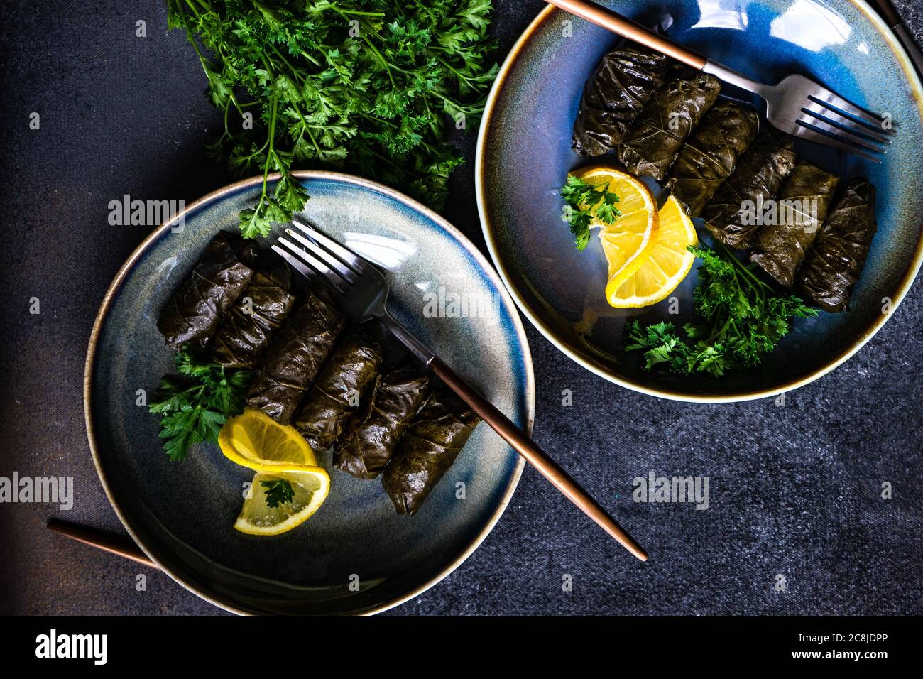 Traditional georgian tolma in vine leaves on rustic background with ...