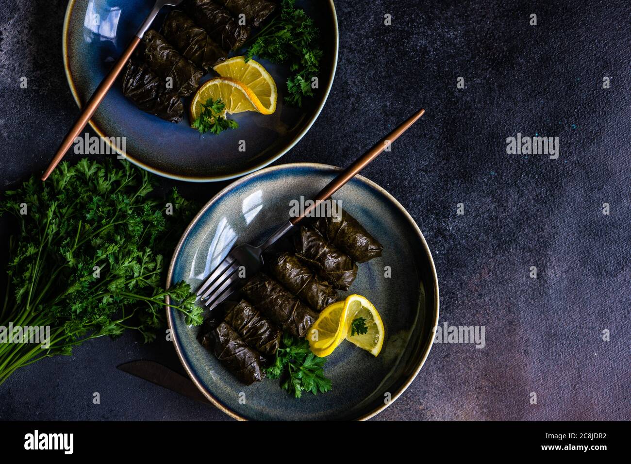 Traditional georgian tolma in vine leaves on rustic background with ...