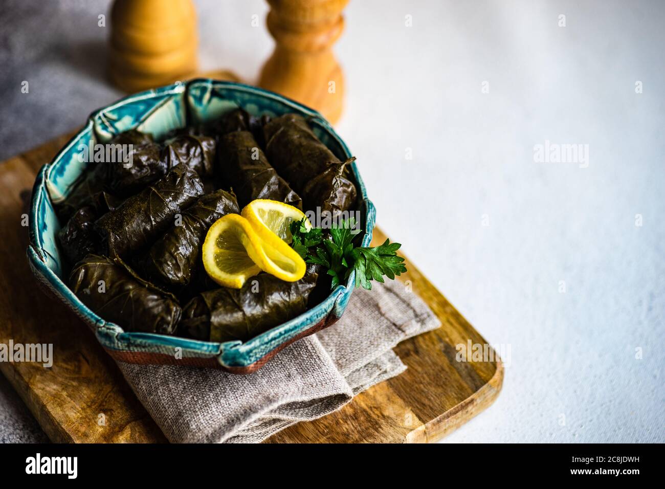 Traditional georgian tolma in vine leaves on rustic background with ...
