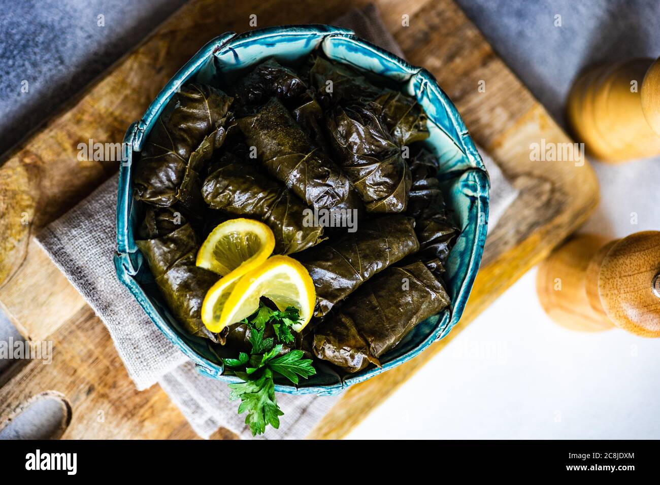 Traditional georgian tolma in vine leaves on rustic background with ...